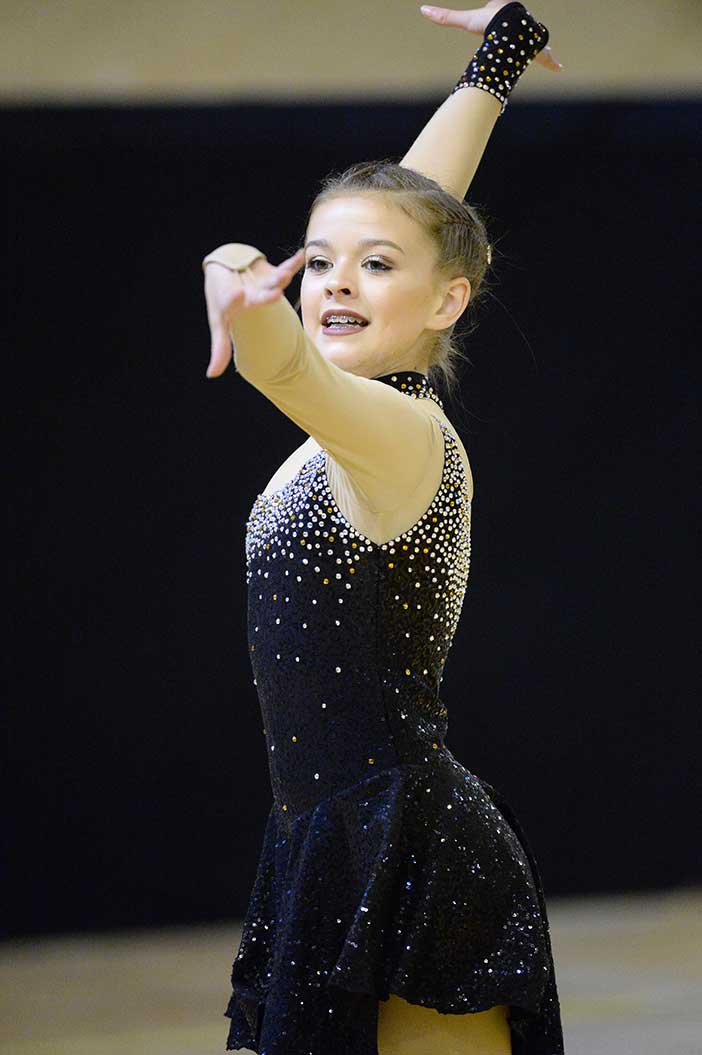 Skater Amy Nelson celebrates at the double on and off the ice