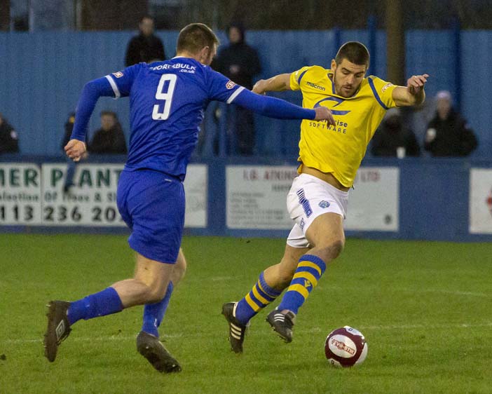 Yellows dig deep for a point in top of the table clash