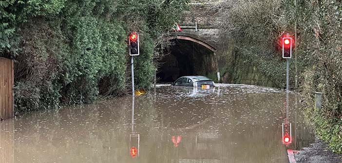 Firefighters rescue people from cars stuck in floodwaters - Warrington ...